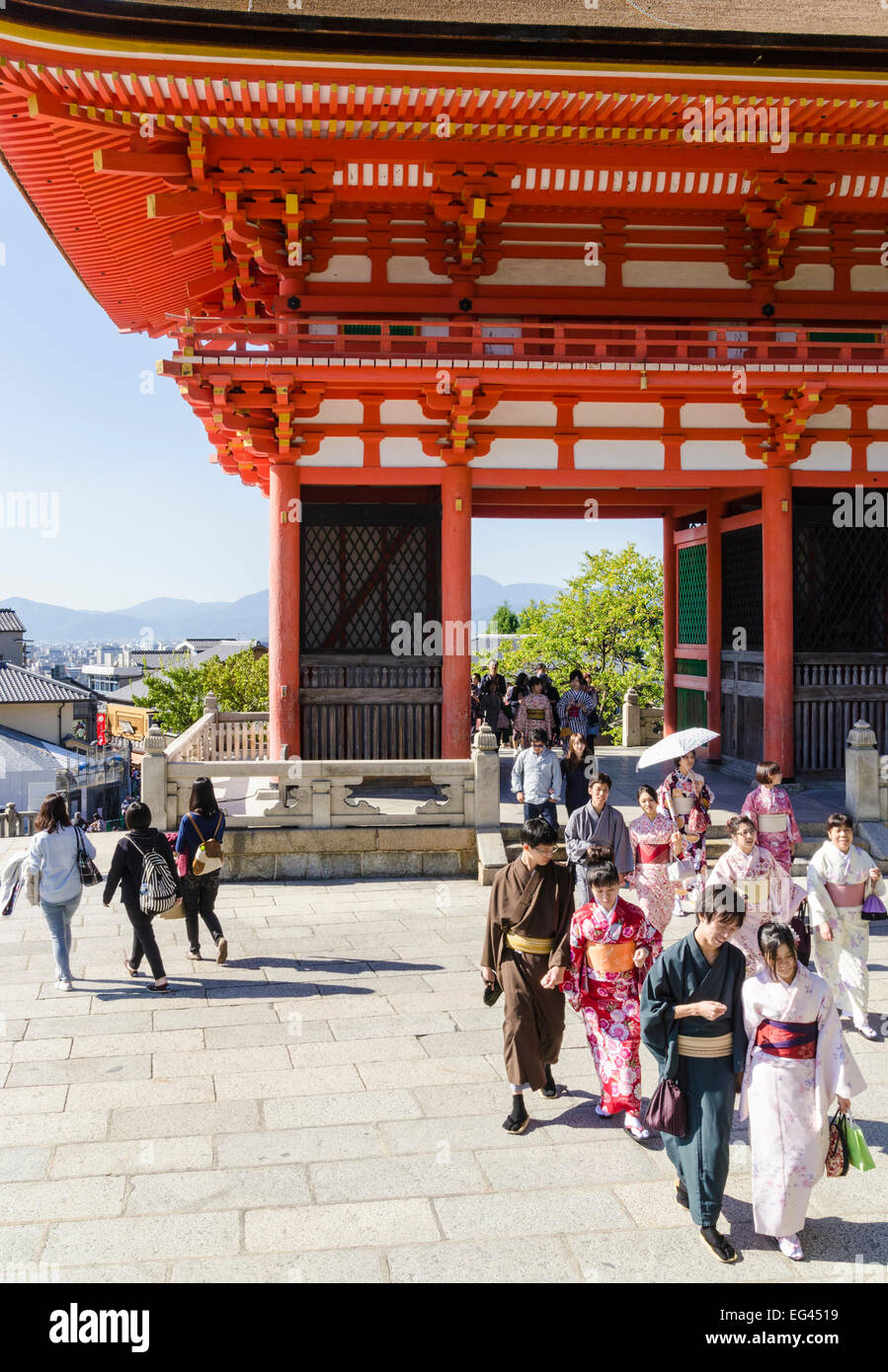 Traditionally dressed Japanese people at the Deva gate entrance to the ...