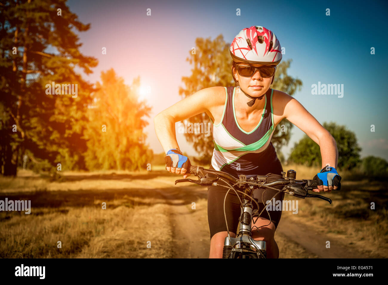 Women on the nature of riding a bike Stock Photo - Alamy