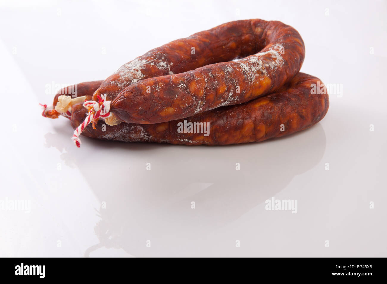 Two red spanish chorizos. Isolated over white background Stock Photo ...
