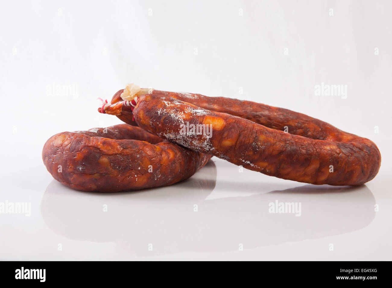 Two red spanish chorizos. Isolated over white background Stock Photo ...