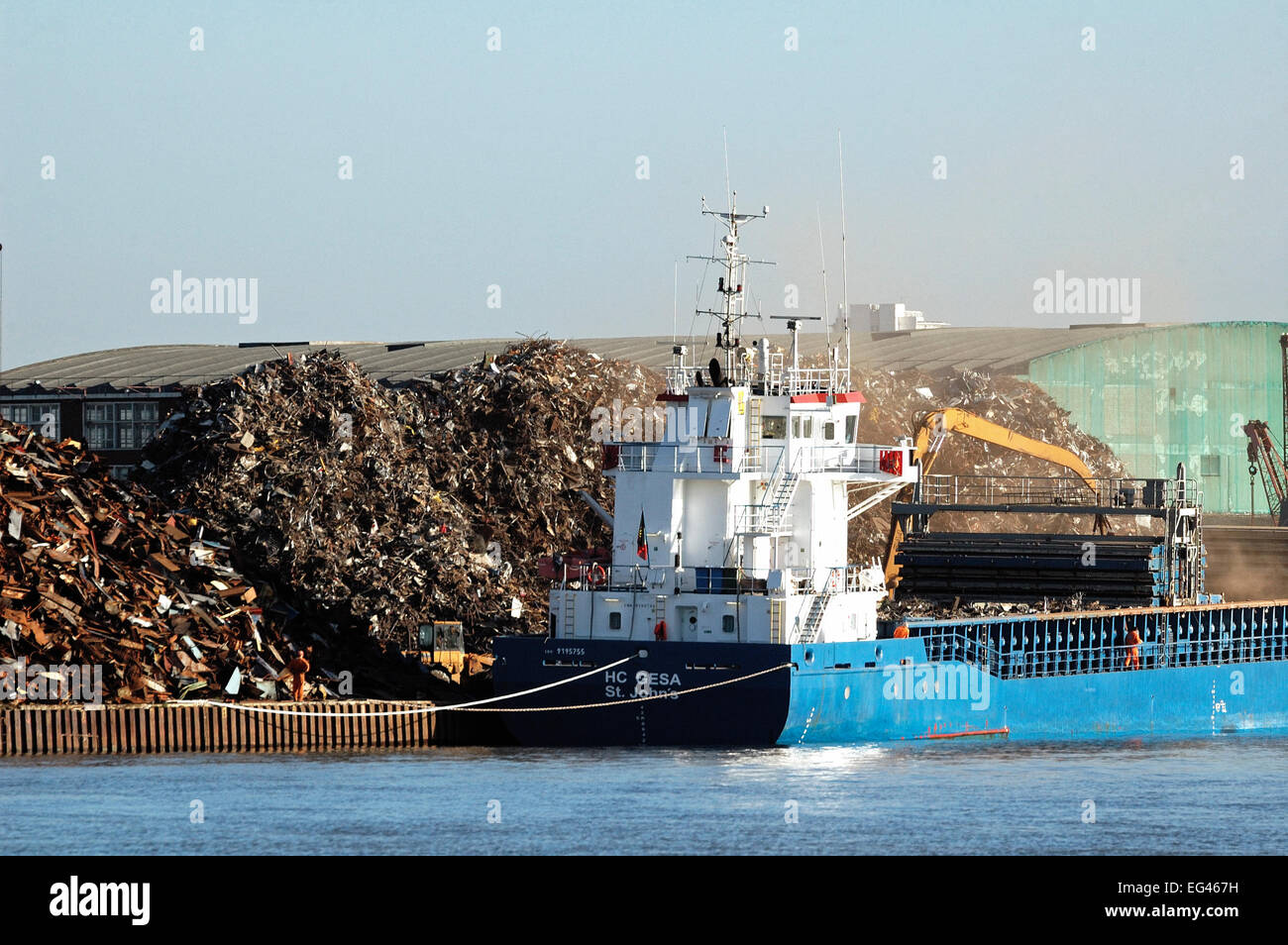 Boat loading or unloading scrap metal River Thames London England UK ...