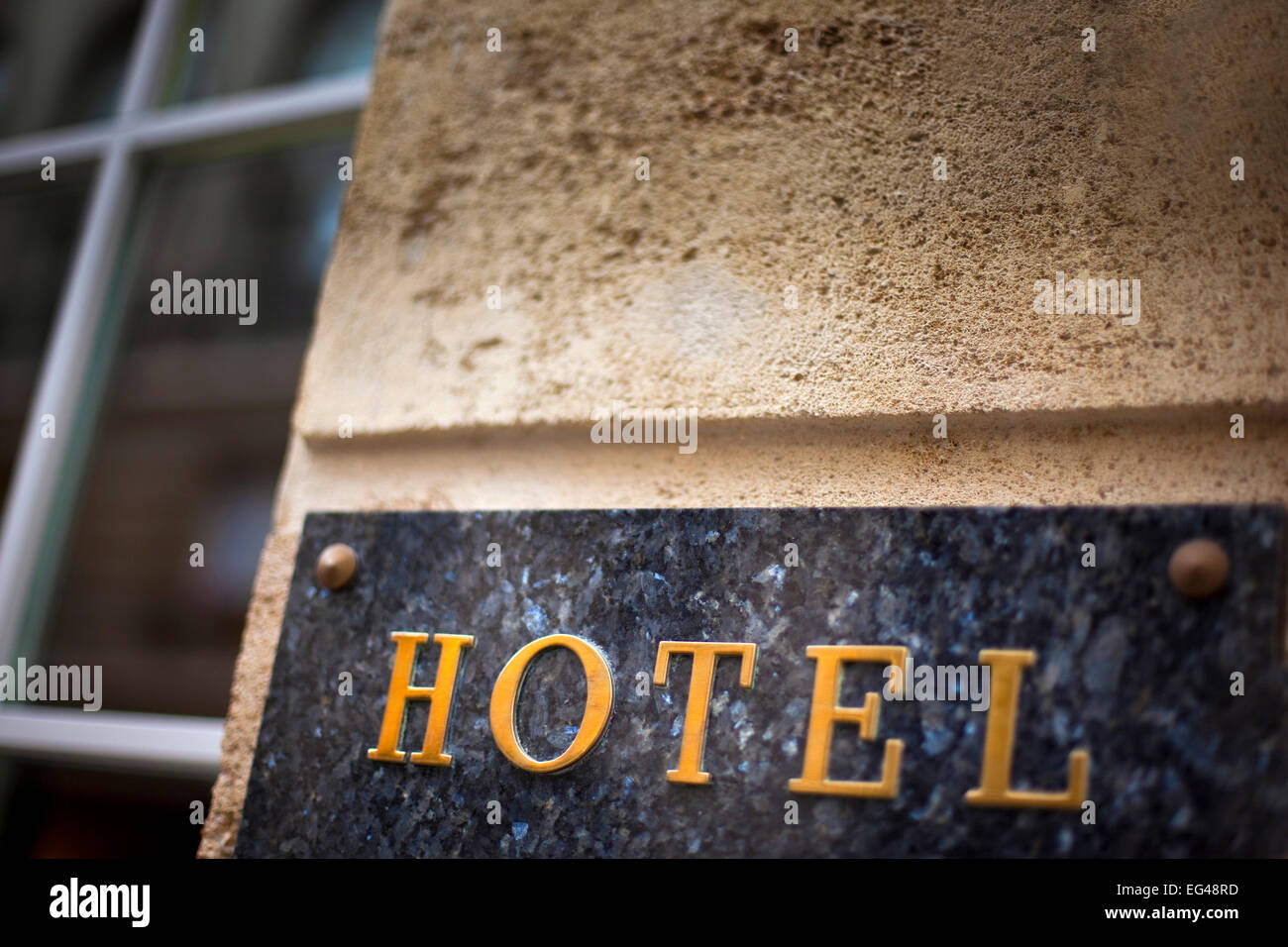 Golden hotel sign at luxurious marble stone hi-res stock photography ...