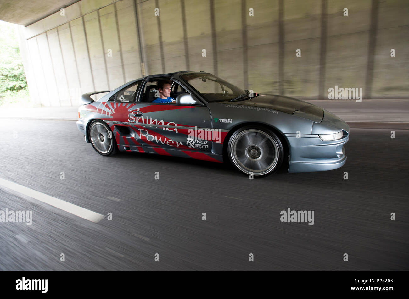 Heavily modified Toyota MR2 sports car driving Stock Photo - Alamy