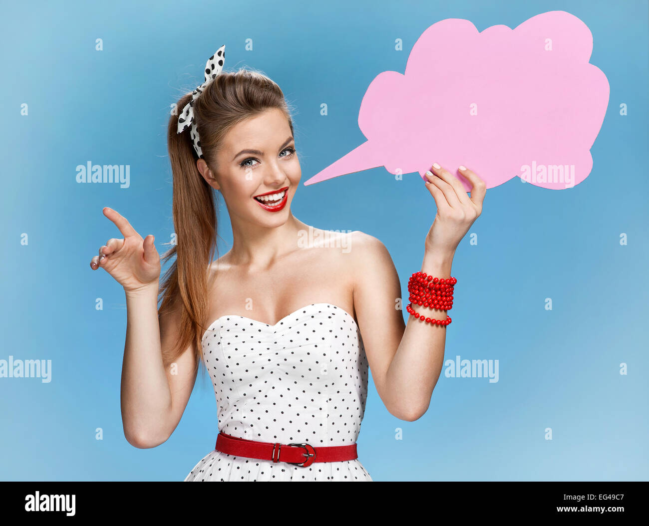 Amazing young woman showing sign speech bubble banner looking happy ...