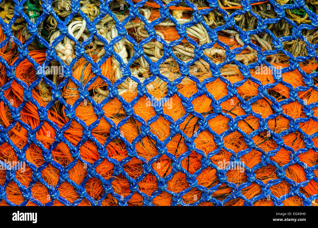 Blue and orange fishing net Stock Photo - Alamy