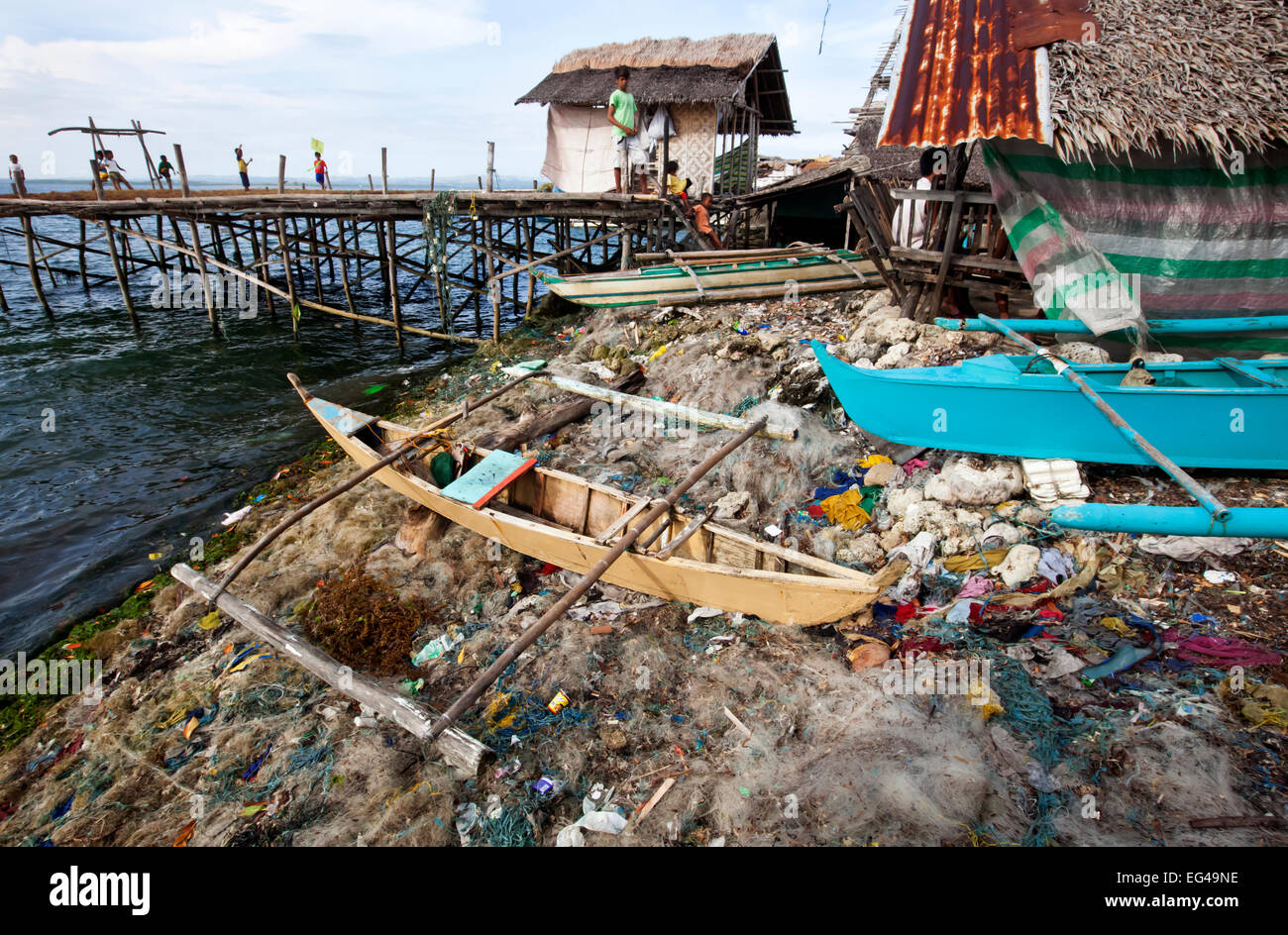 Discarded nets bangka canoe other garbage at the beach Guindacpan ...