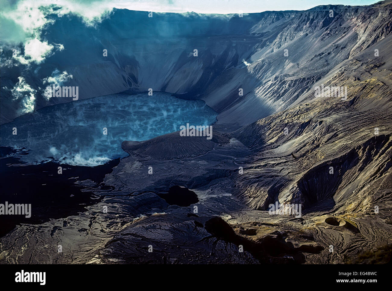 Volcanic caldera - caldera lake steaming after eruption. Fernandina ...