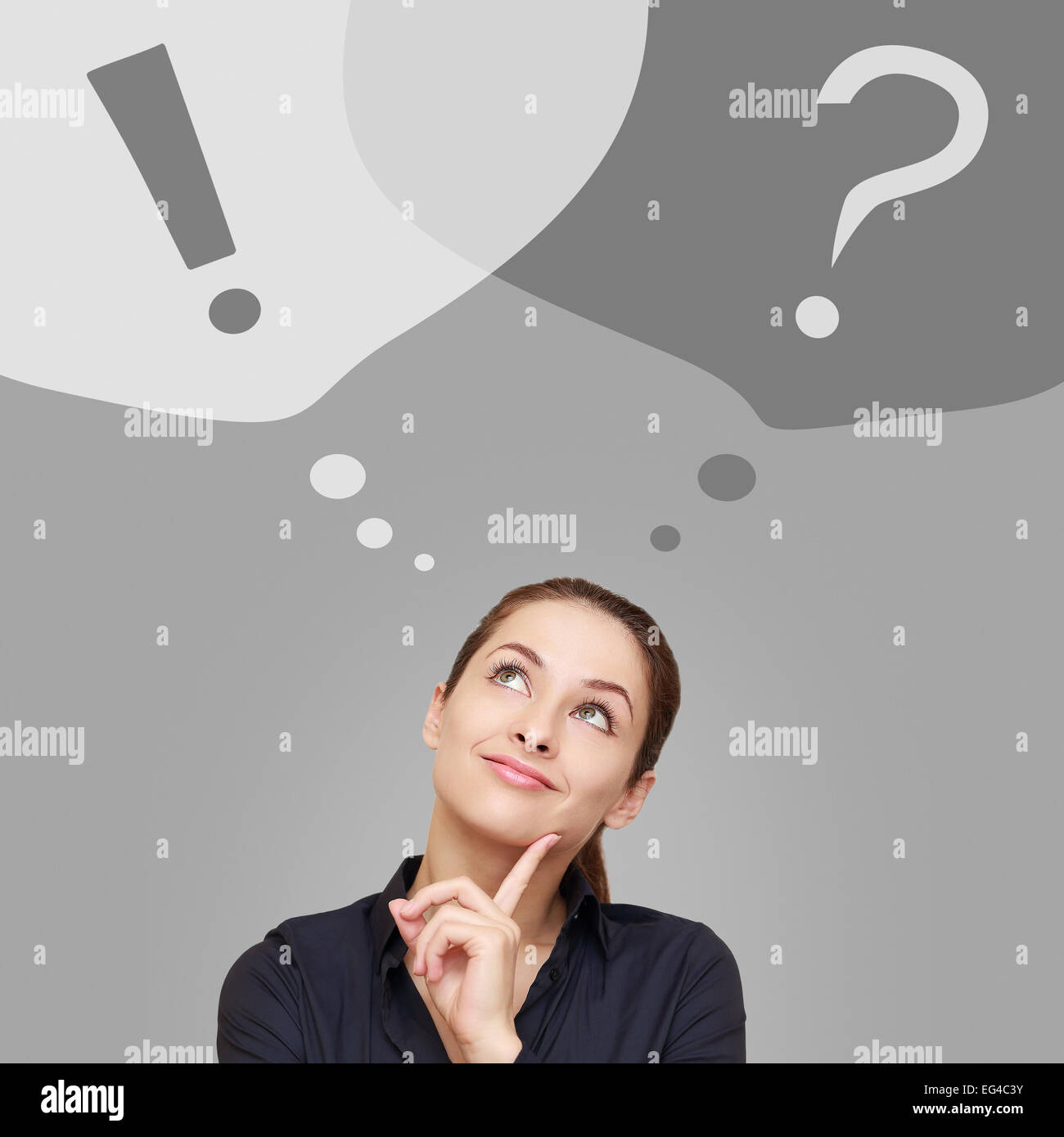 Thinking business woman looking up on question and exclamation signs in ...