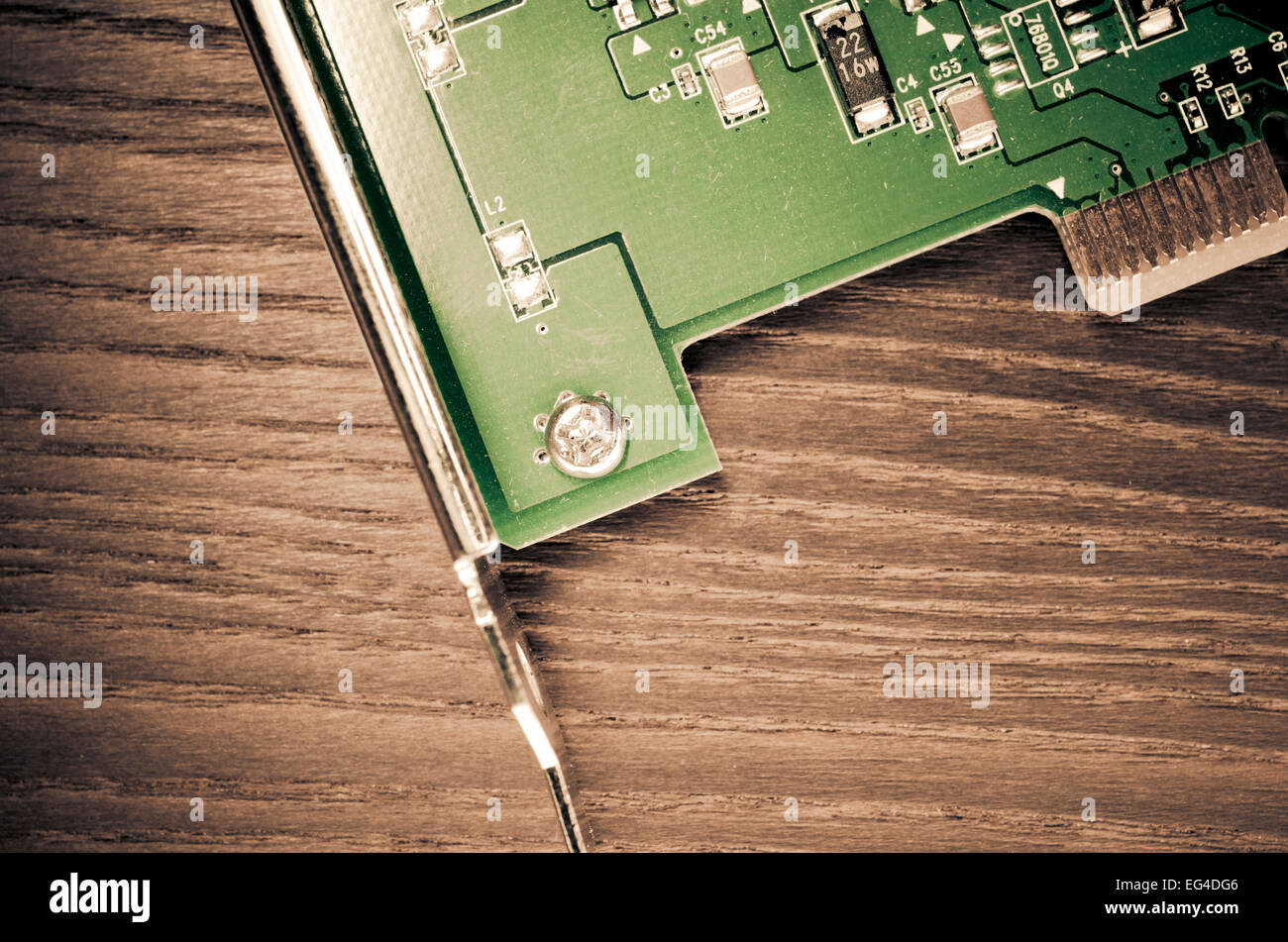 detail of an electronic pcb with connector on a wood background Stock ...