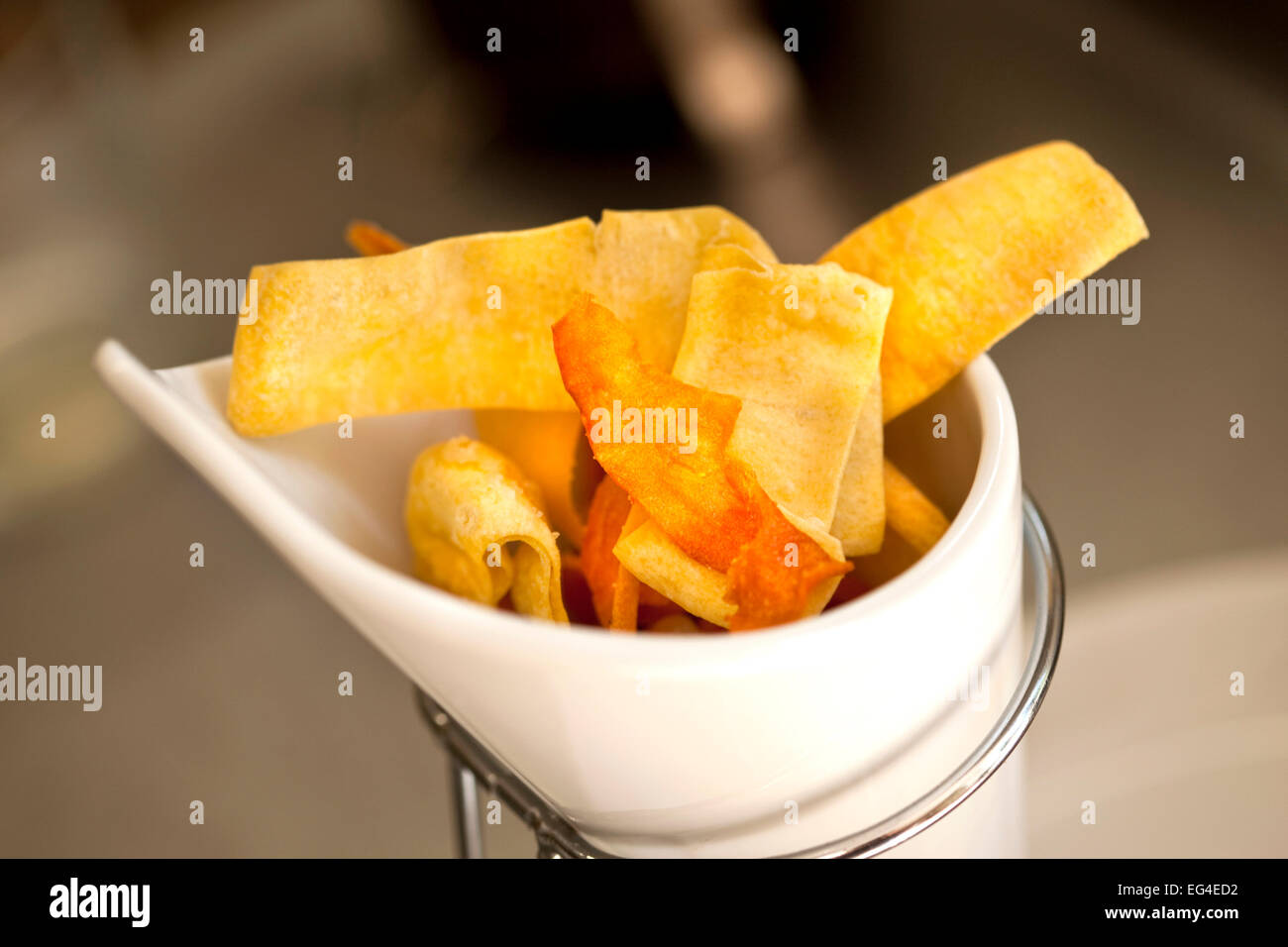 Popato chips in a porcelain bowl Stock Photo - Alamy