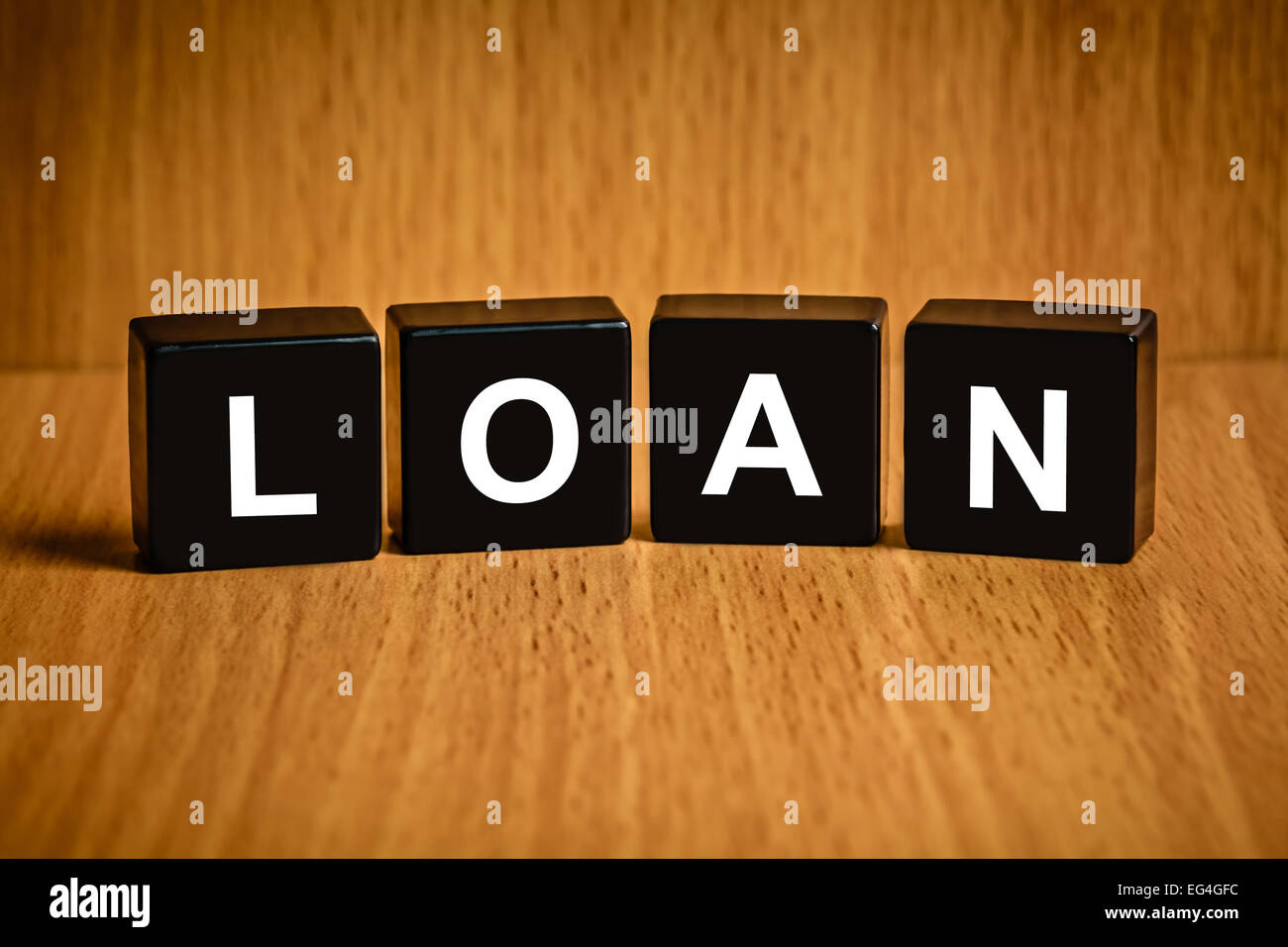 financial loan text on black block, business concept Stock Photo - Alamy