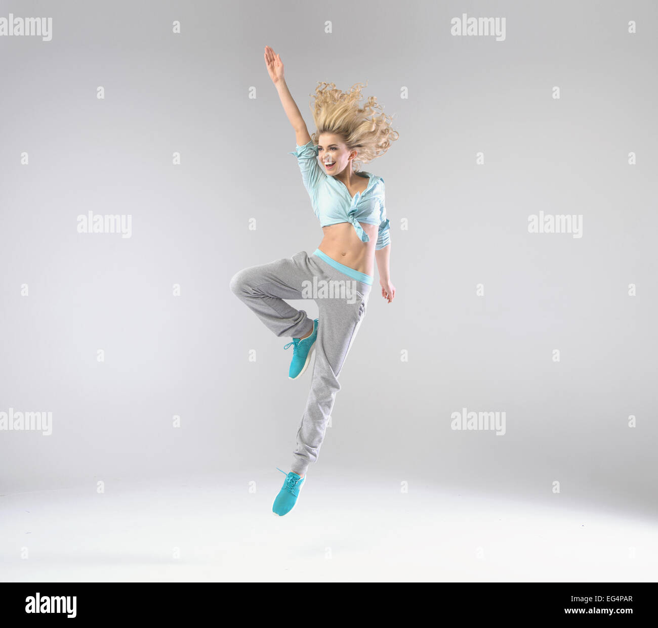 Portrait of cheerful jumping lady Stock Photo - Alamy