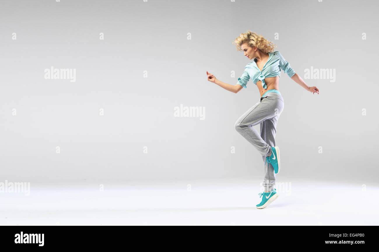 Jumping cheerful and attractive woman Stock Photo - Alamy