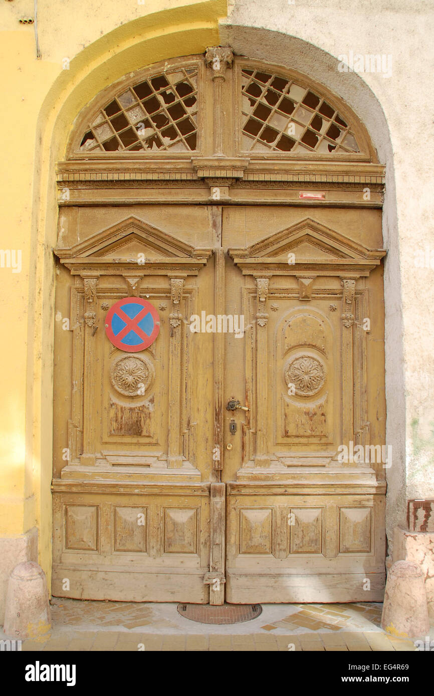 Old big and massive front door of the building. The building was built ...