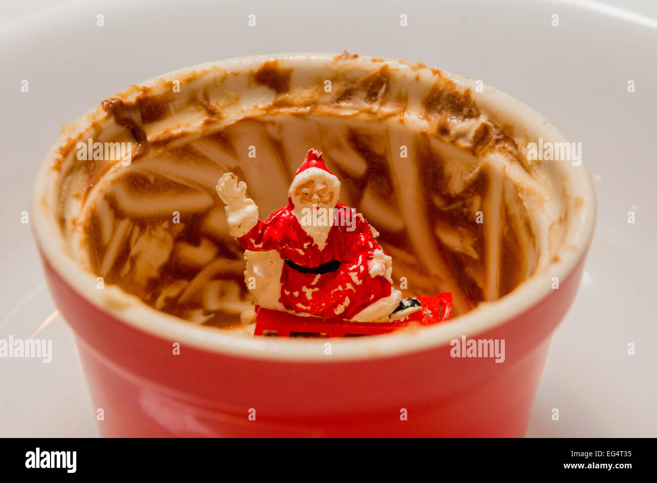 Plastic Santa on a sledge in a finished chocolate mousse pot Stock ...