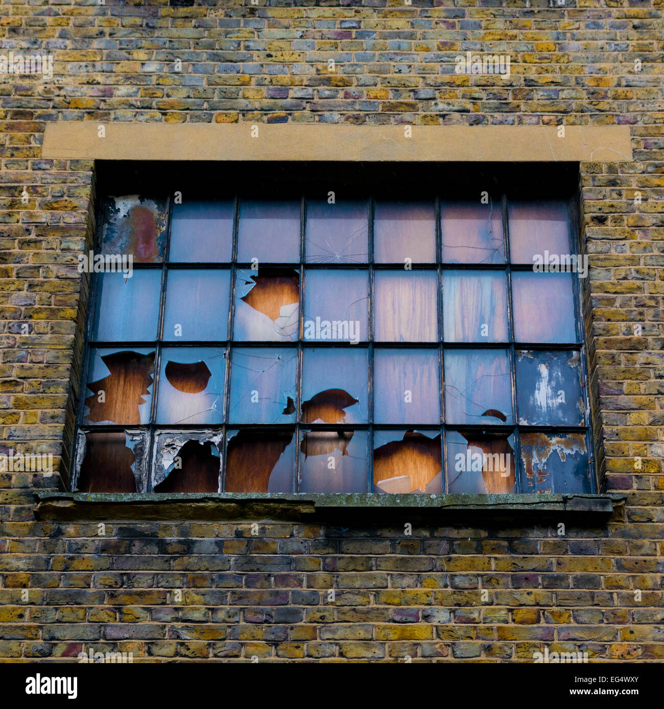 Broken window of abandoned building East London Stock Photo - Alamy