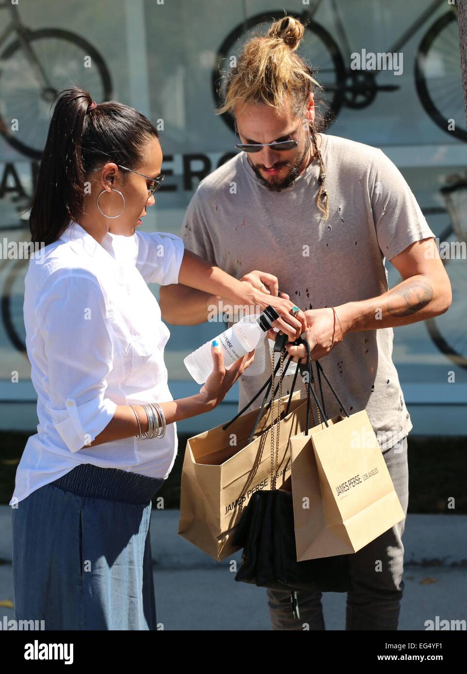 Zoe Saldana and her husband Marco Perego exit the James Pearce shop ...