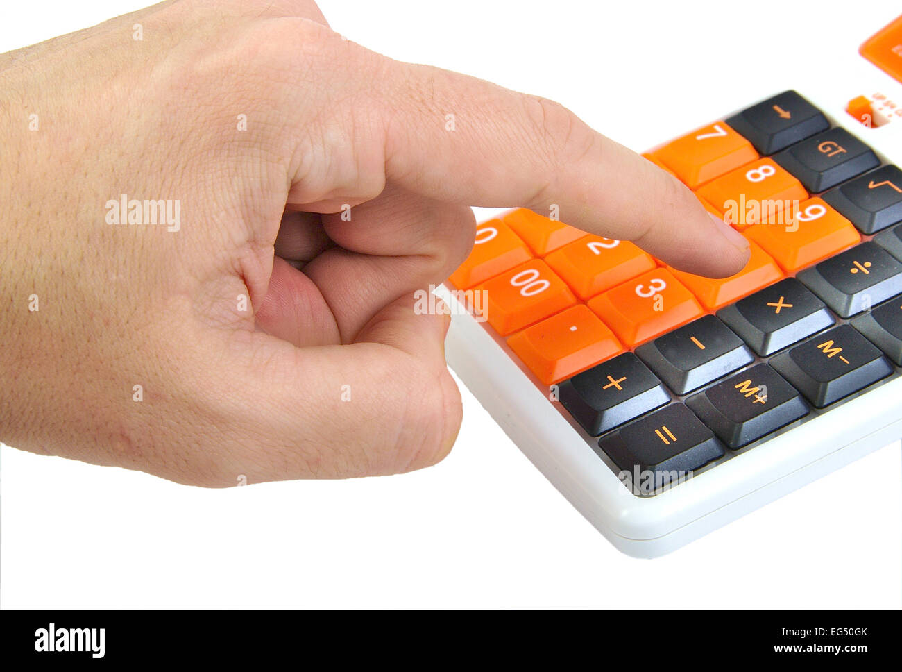 Man hand making calculations on an orange calculator isolated on white ...