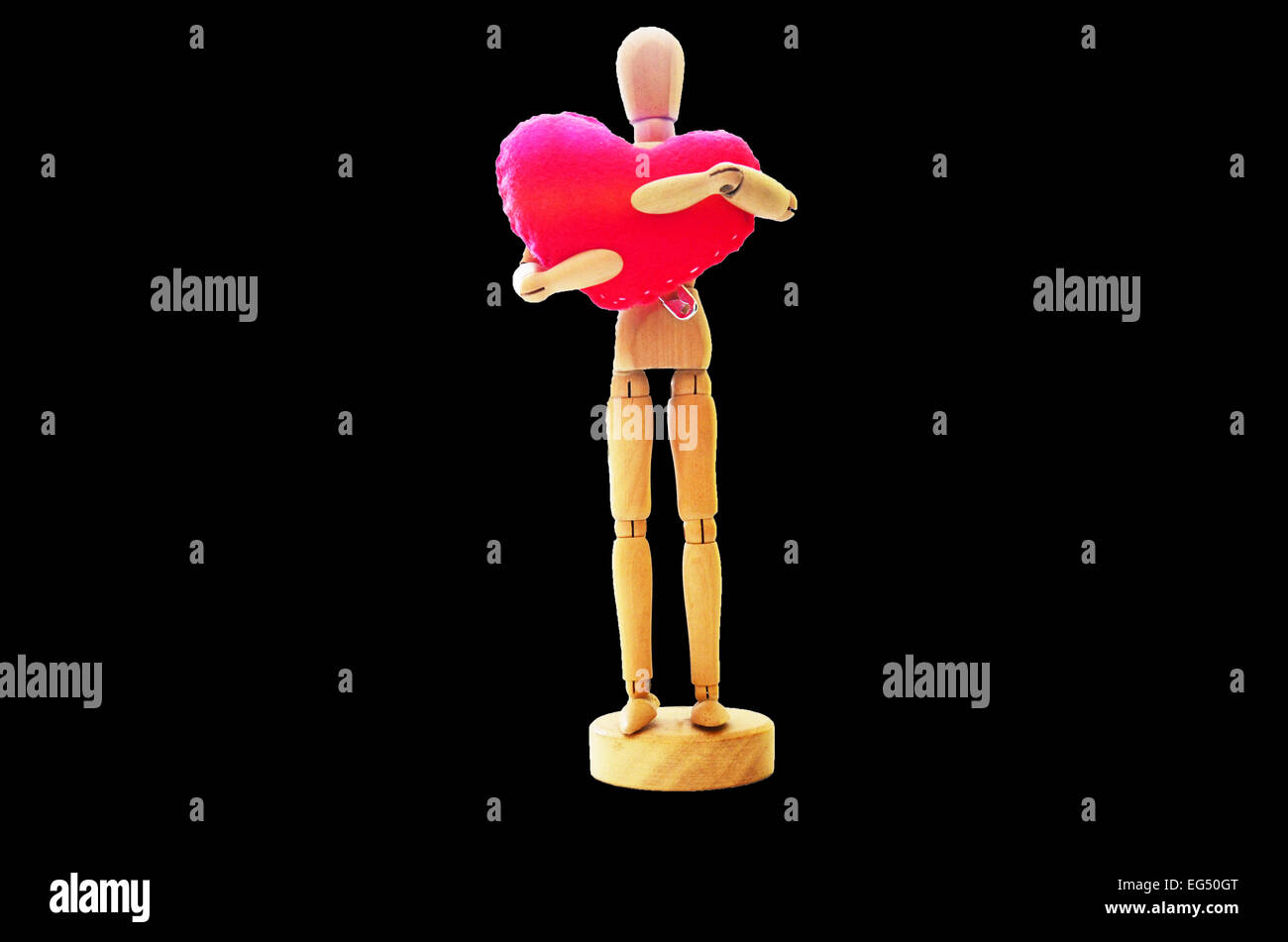 Human wooden figure with Handmade Heart model made from velvet Stock ...