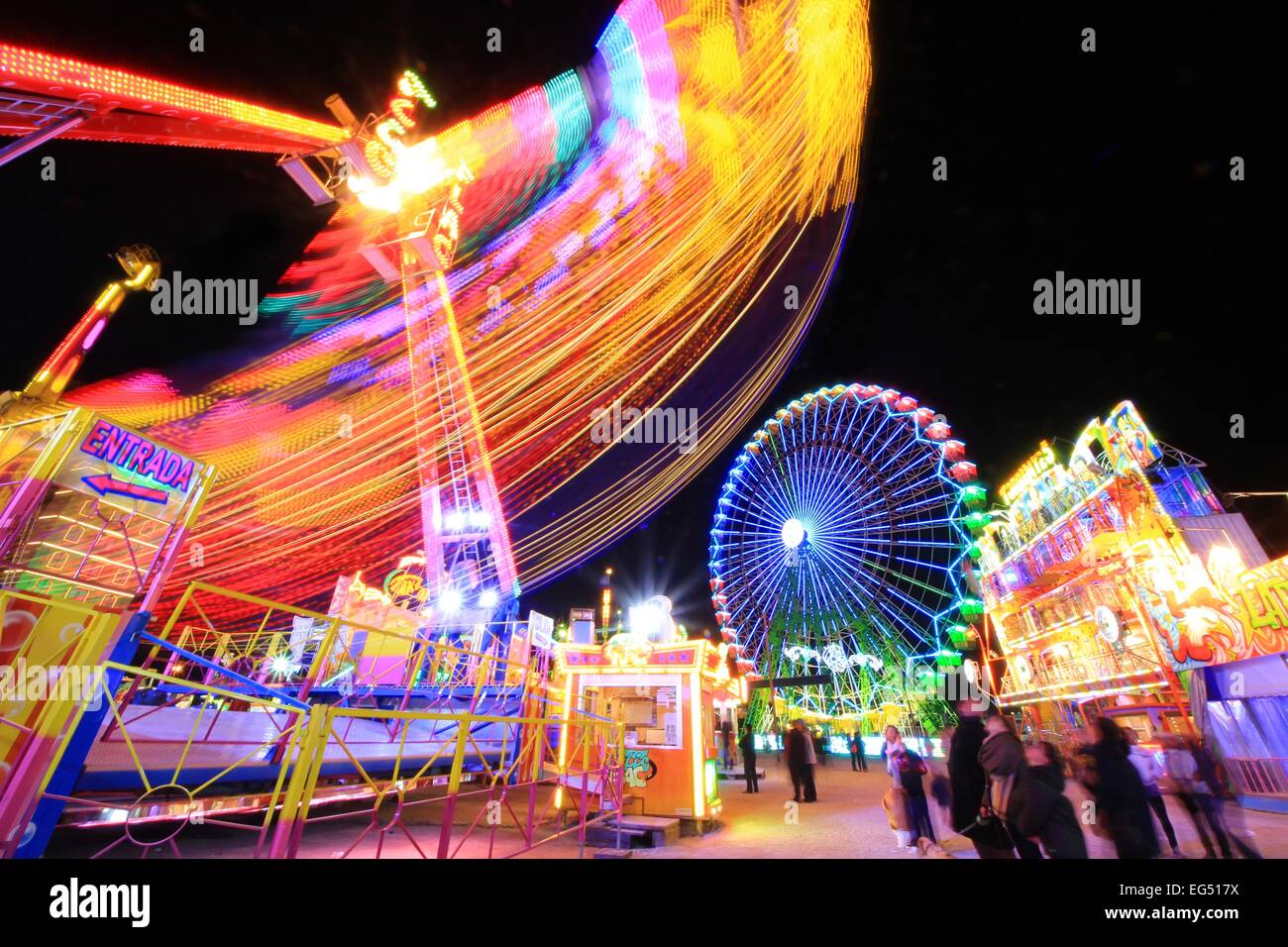 Carousel and color games in amusement park at night Stock Photo - Alamy