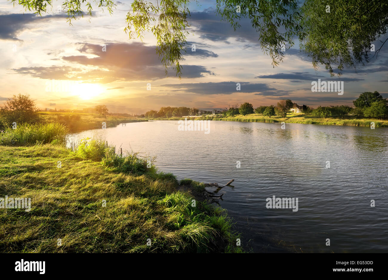 Beautiful sundown over the river in summer Stock Photo - Alamy