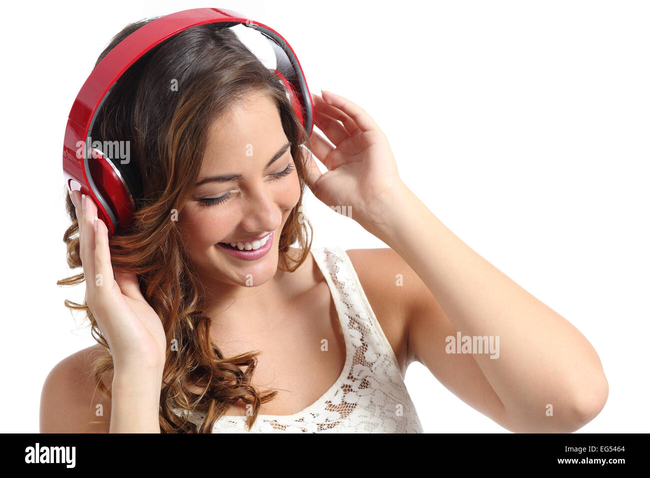 Young Happy Woman Enjoying Listening To The Music From Headphones