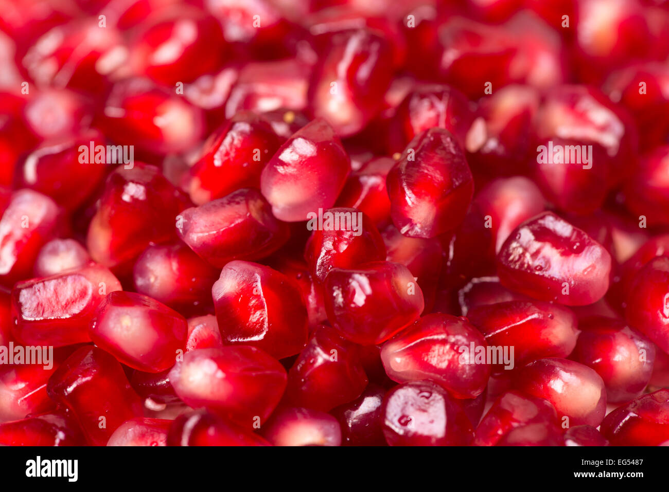 a lot of ripe and red garnet grains Stock Photo - Alamy