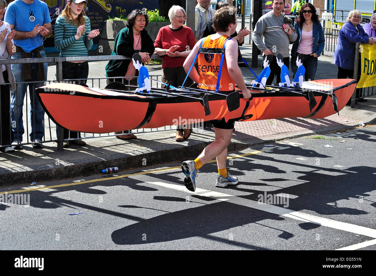charity runner dressed in canoe costume taking part in the london ...