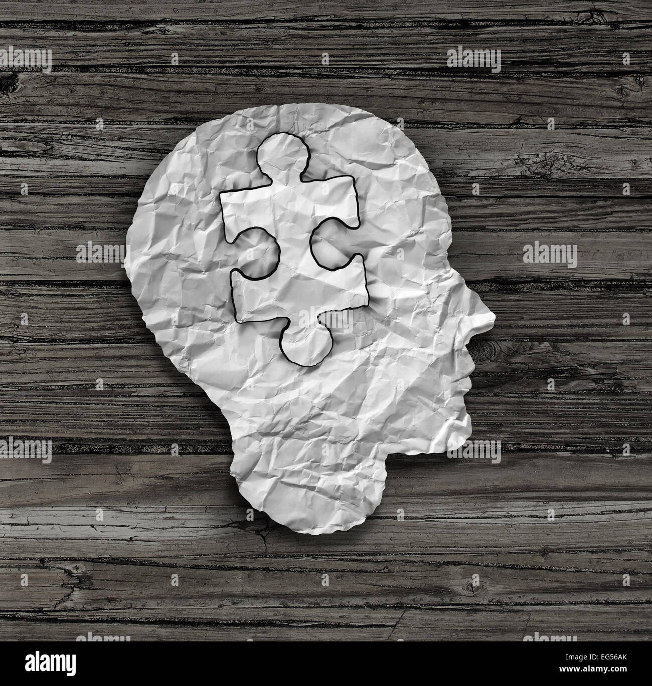 Puzzle head solution concept as a human face profile made from crumpled ...