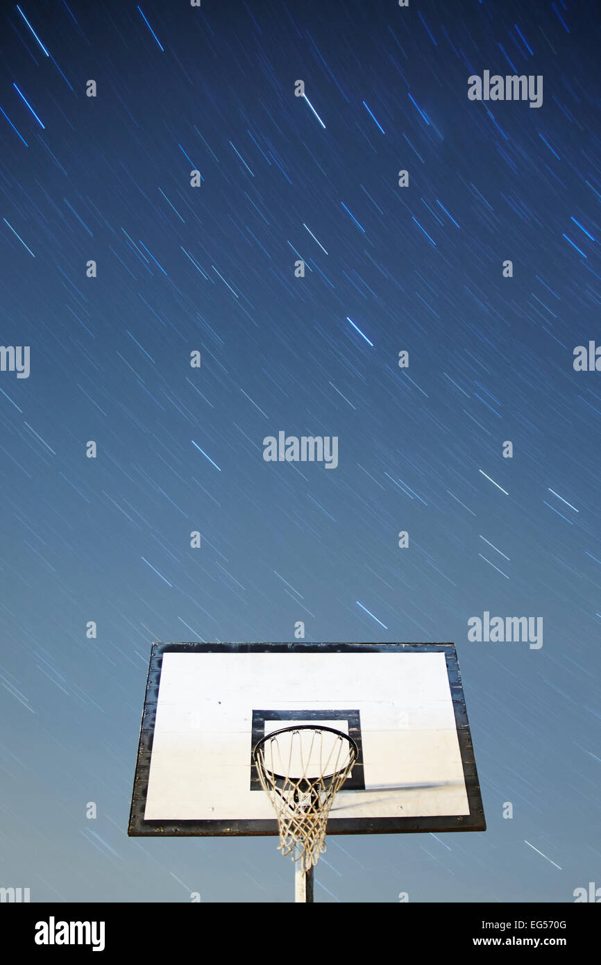 A basketball hoop and star trails Stock Photo - Alamy