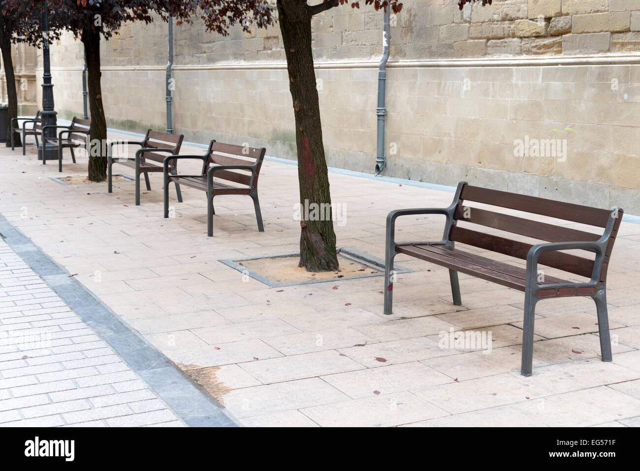 Park benches on a street in Legrono Spain forming an interesting ...