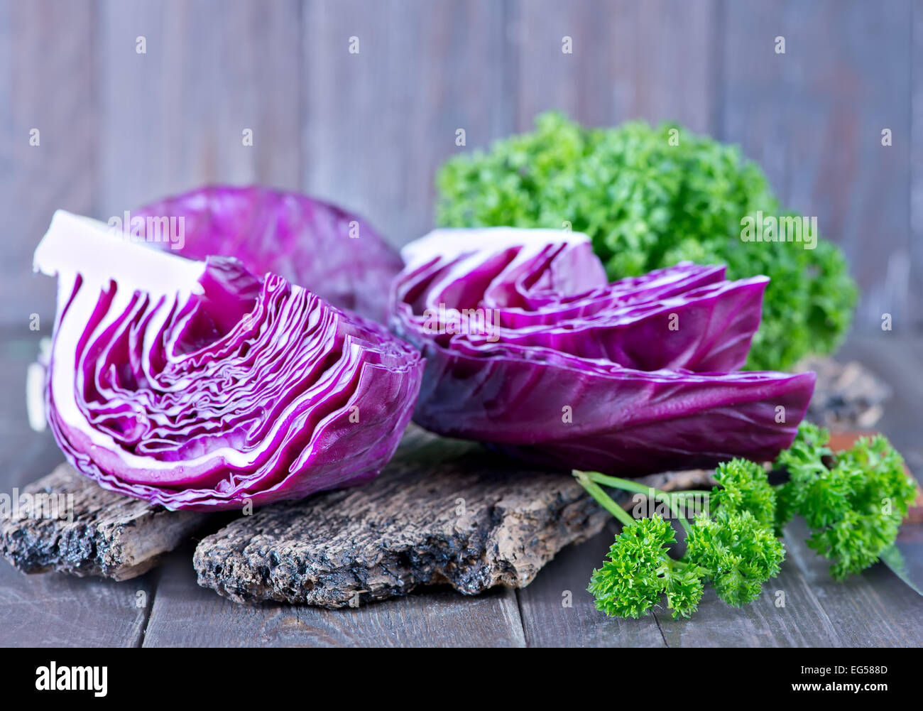 blue cabbage on board and on a table Stock Photo - Alamy