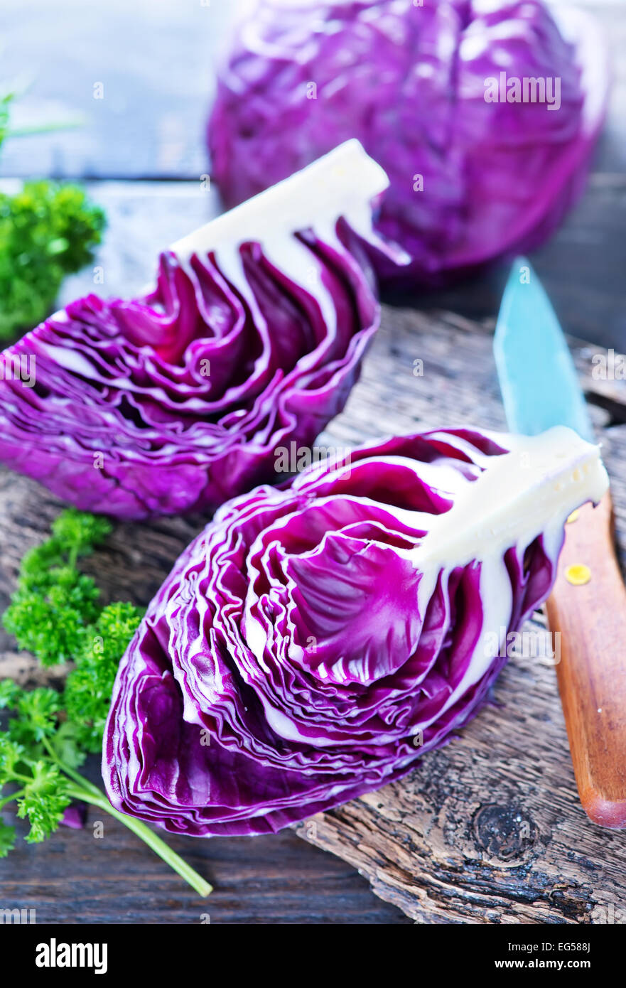 blue cabbage on board and on a table Stock Photo - Alamy