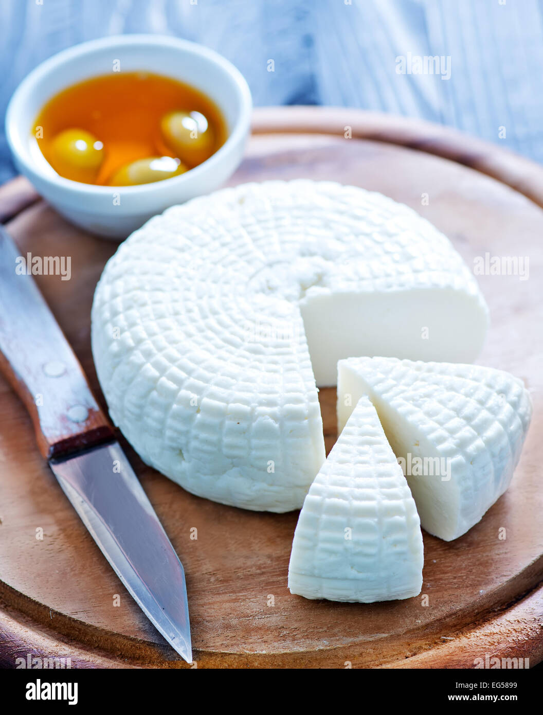 round cheese and aroma spice on wooden board Stock Photo - Alamy