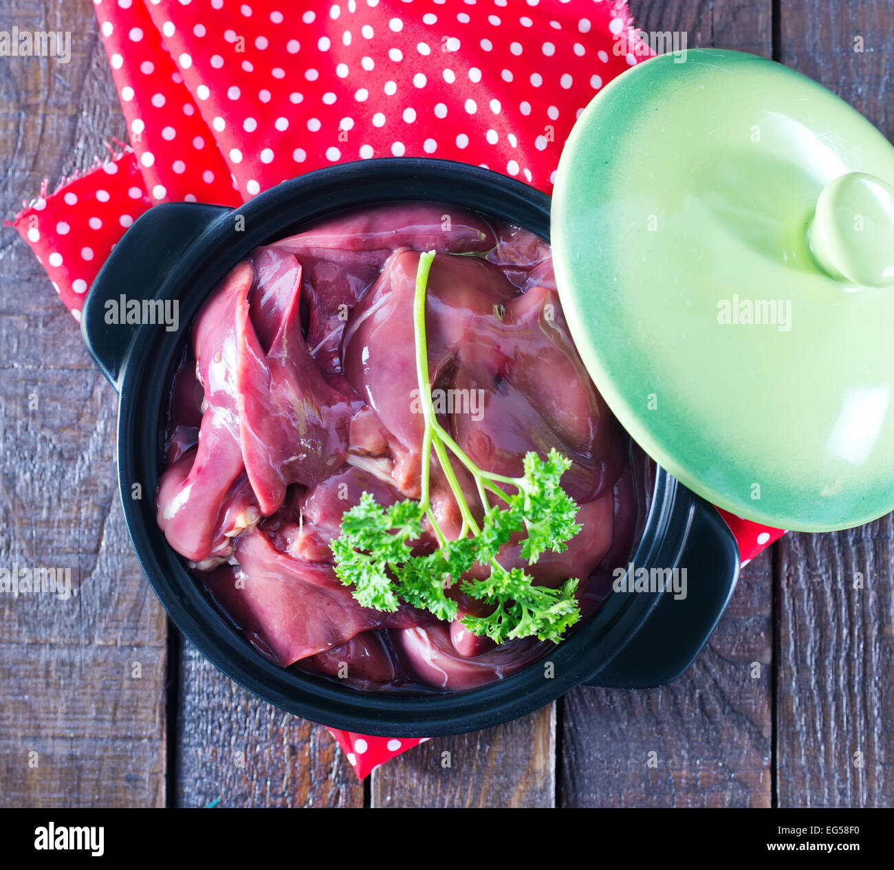 raw liver in bowl and on a table Stock Photo - Alamy