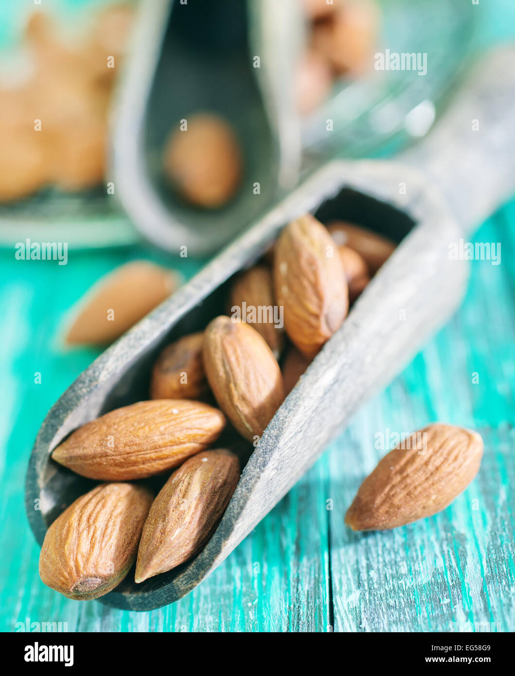 almond in spoon and on a table Stock Photo - Alamy