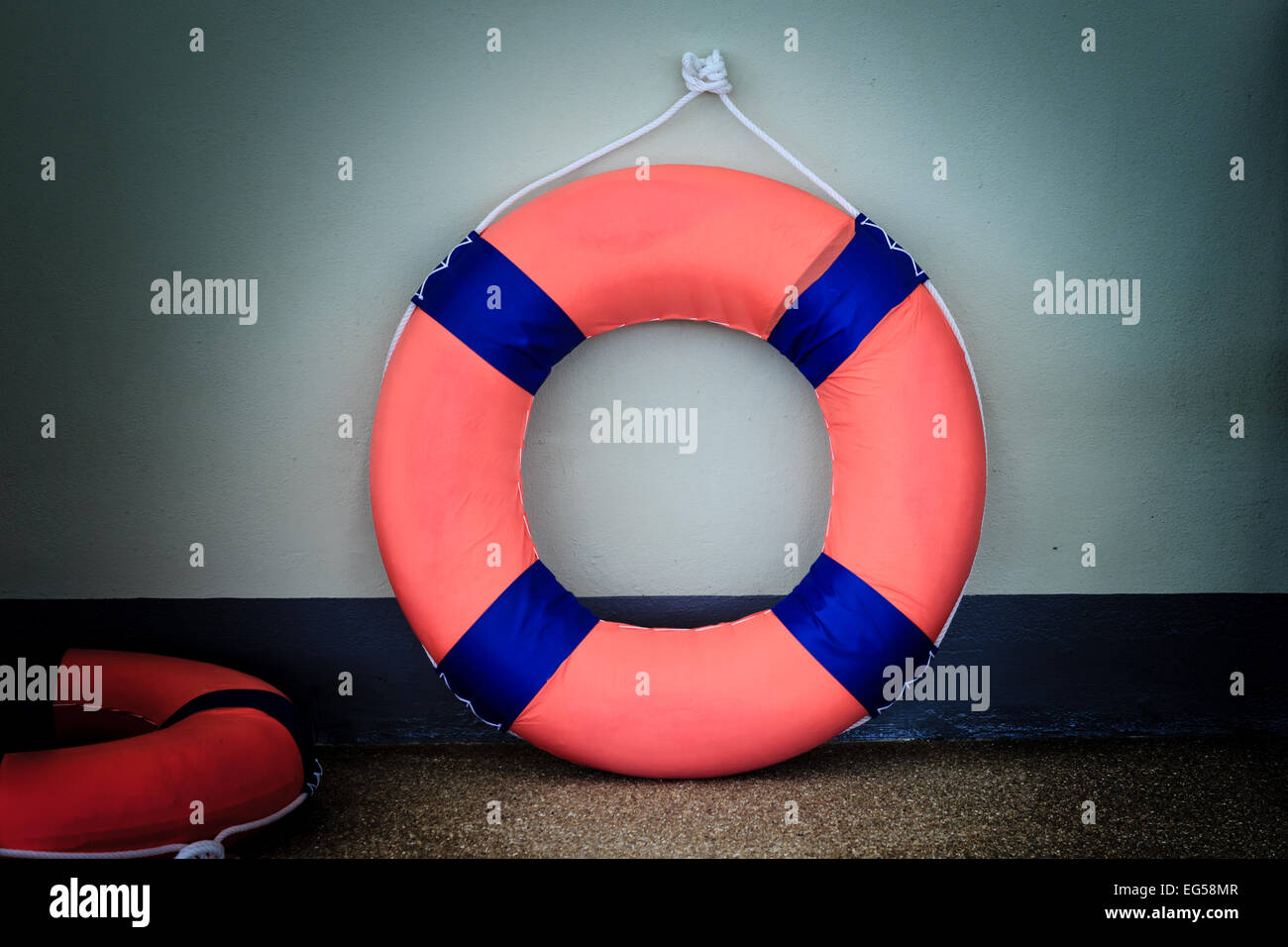 Orange & Blue Lifebuoy and Life ring (vintage style Stock Photo - Alamy