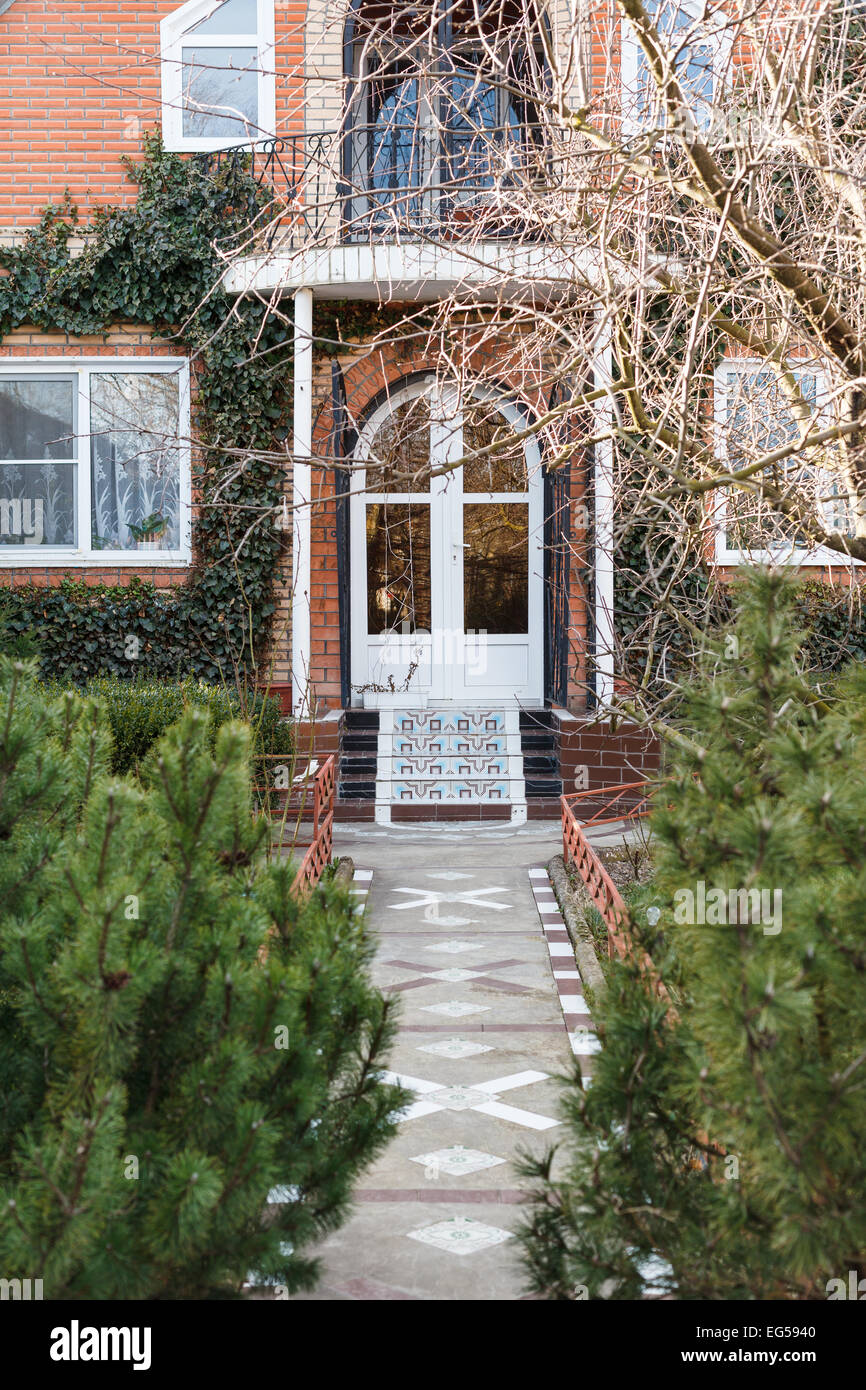 front view of entrance in country house in early spring day Stock Photo ...