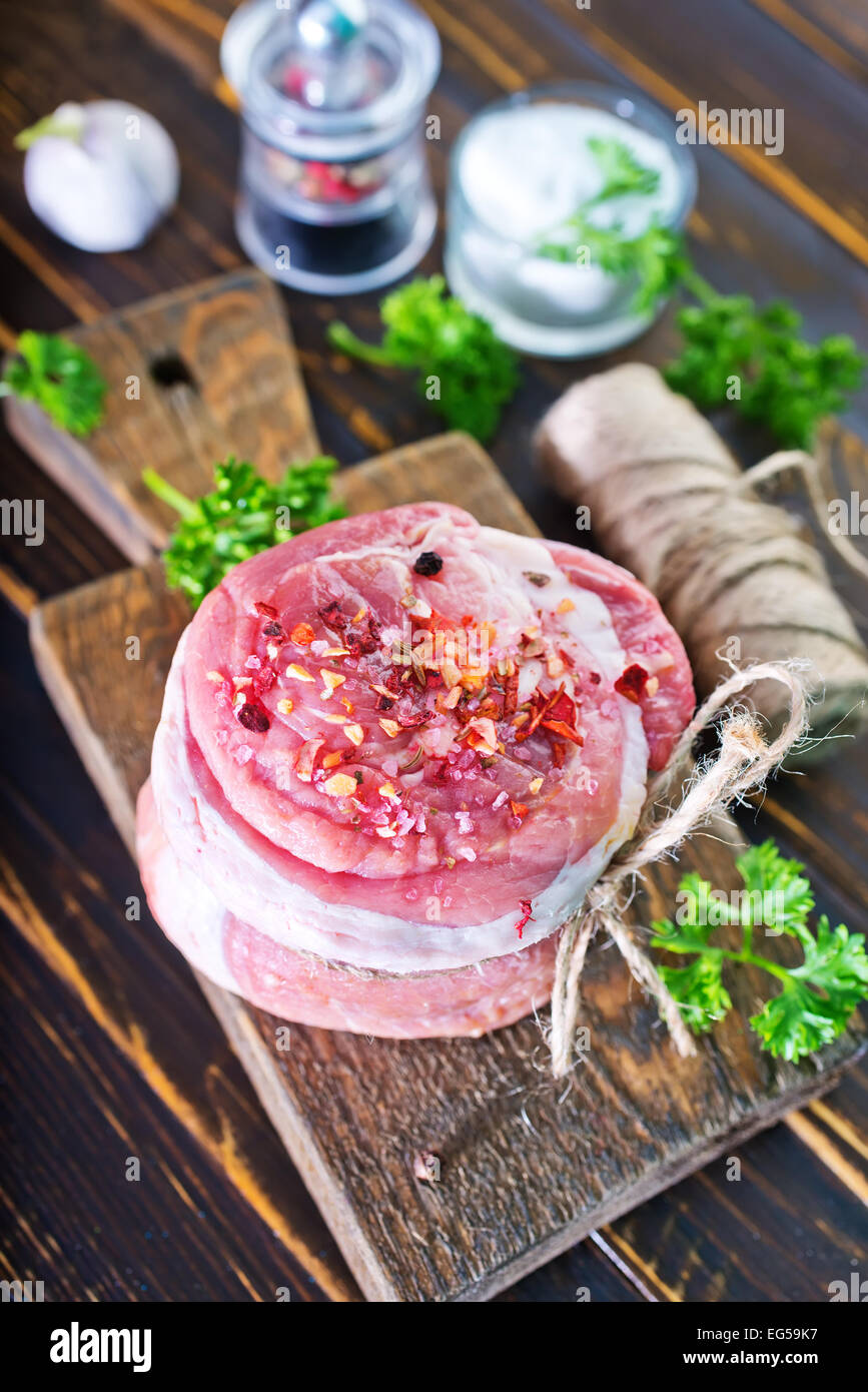 raw meat with salt and spice on the wooden board Stock Photo - Alamy
