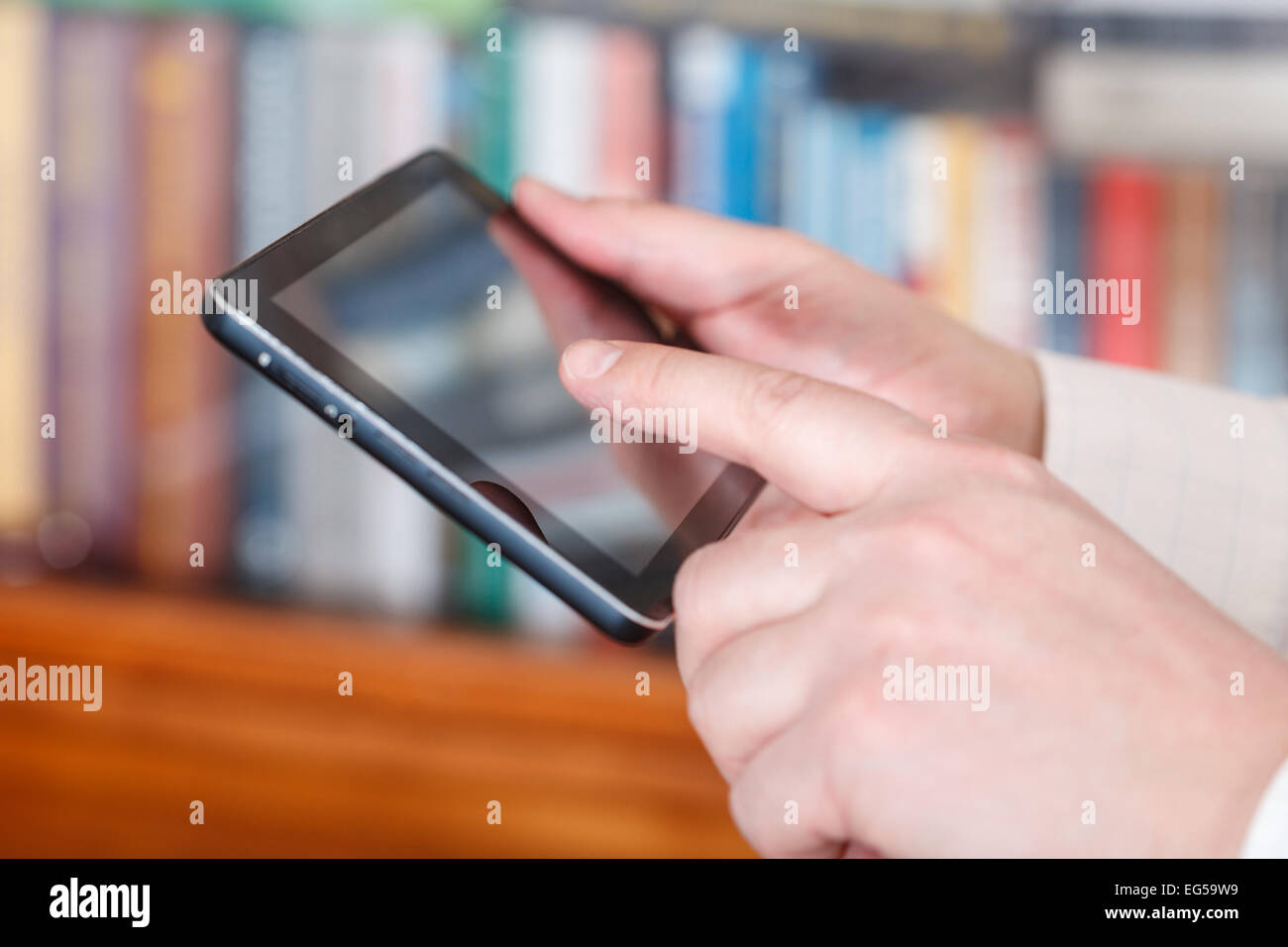 businessman click tablet pc screen in office room Stock Photo - Alamy