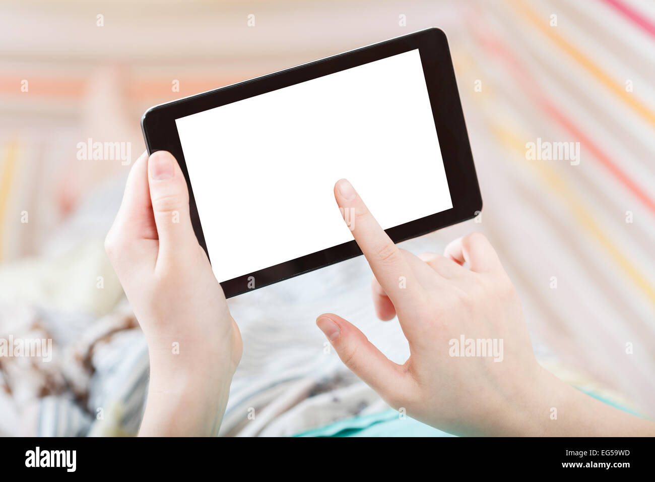 girl touching tablet pc with cut out screen in living room Stock Photo ...