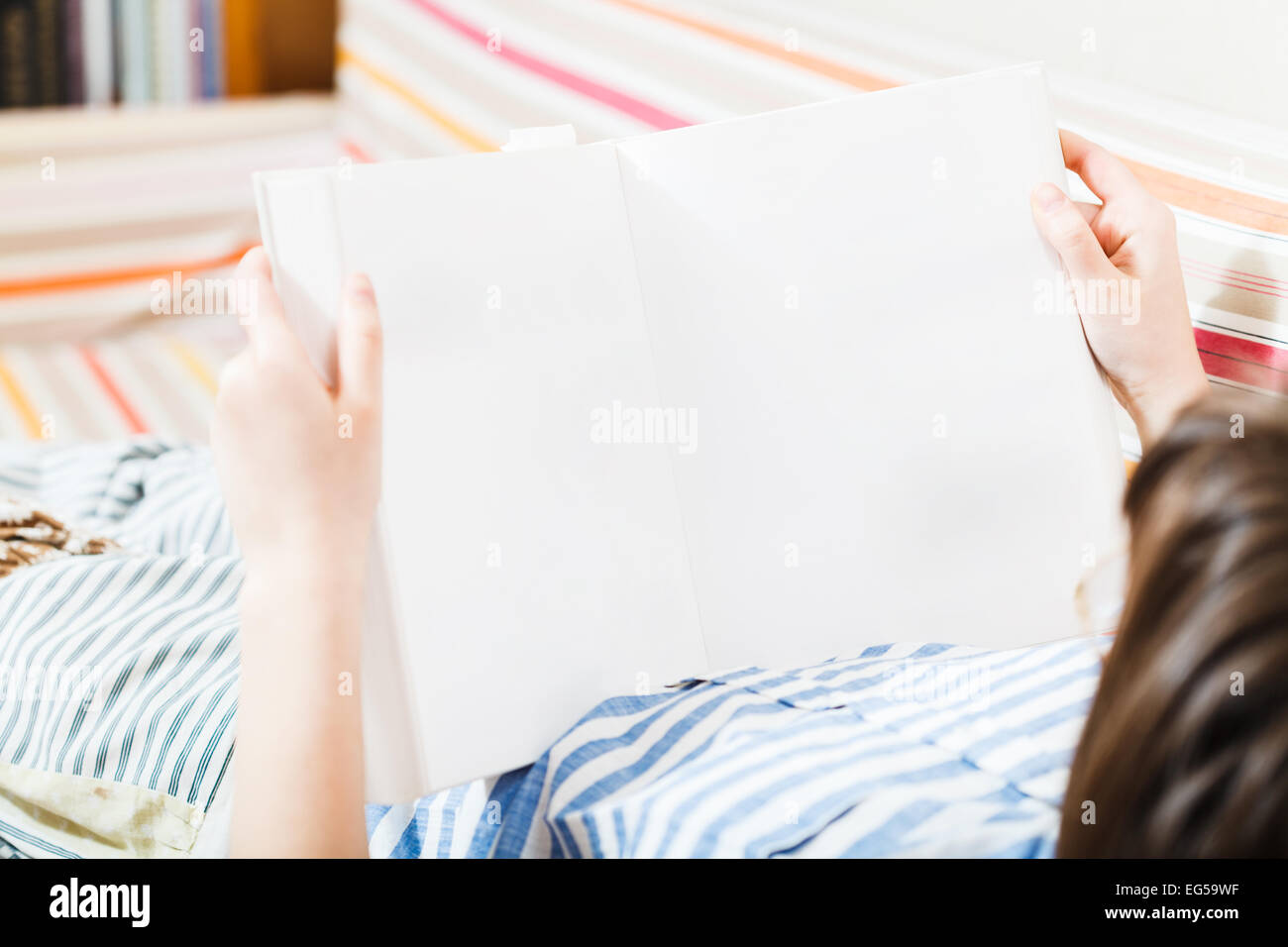 girl read book with blank pages in living room Stock Photo - Alamy