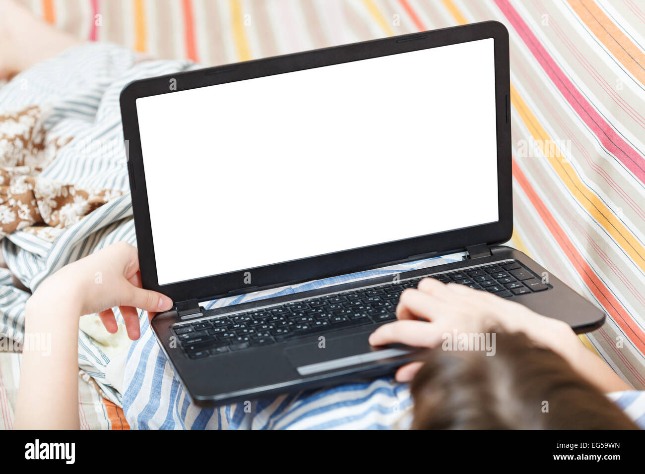 girl works on laptop with cut out screen in living room Stock Photo - Alamy