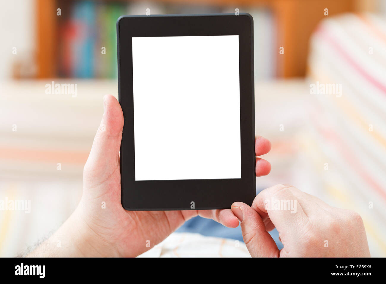 man read with e-book reader with cut out screen in living room Stock ...