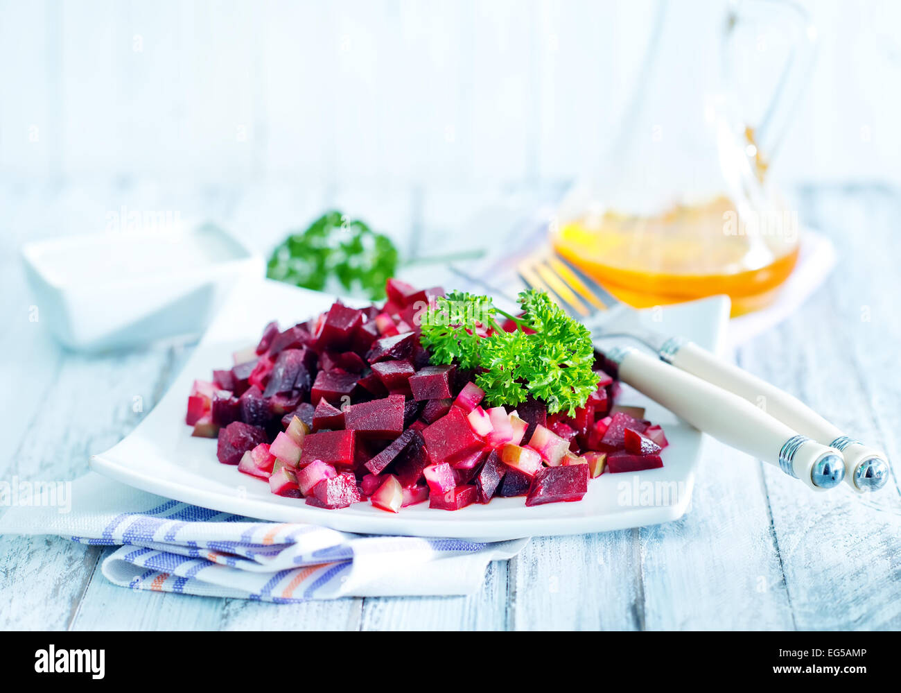 beet salad on plate and on a table Stock Photo - Alamy