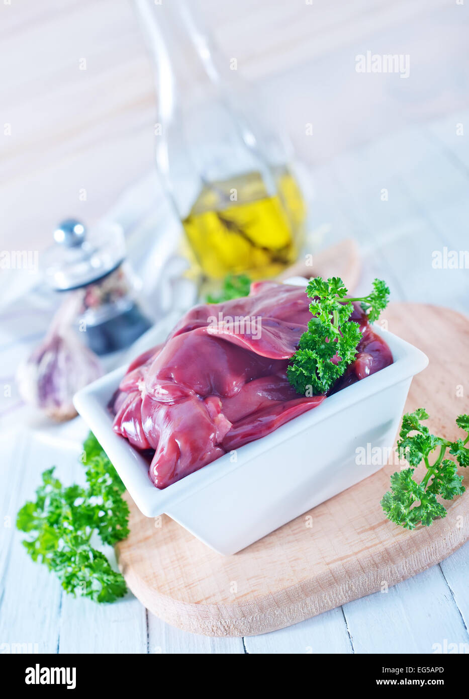 raw liver in bowl and on a table Stock Photo - Alamy
