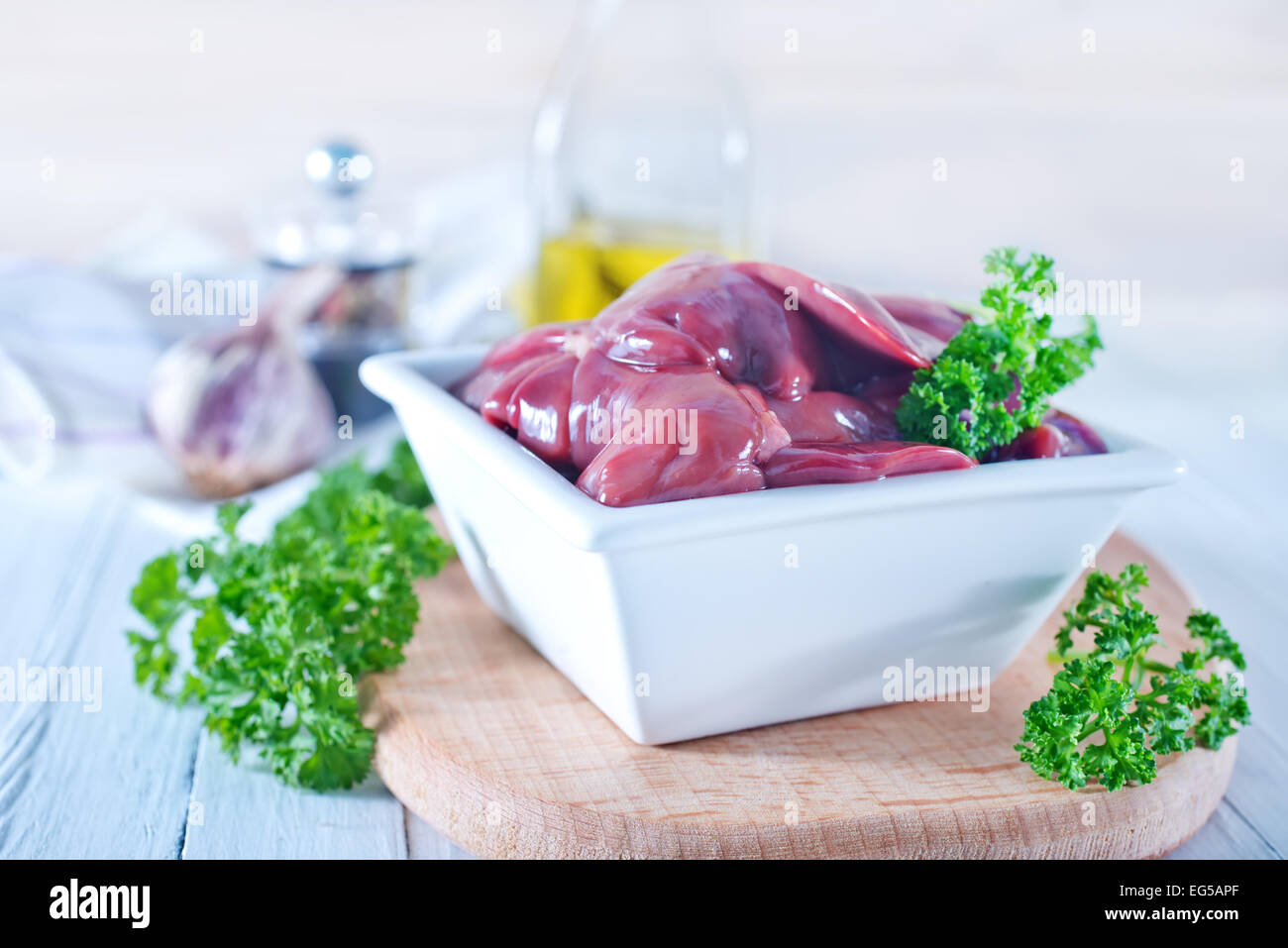 raw liver in bowl and on a table Stock Photo - Alamy