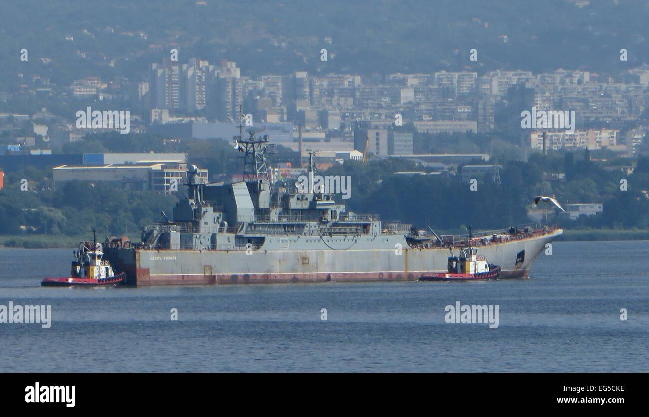 The Russian landing ship Caesar Kunikov is supported by tug boats as it ...