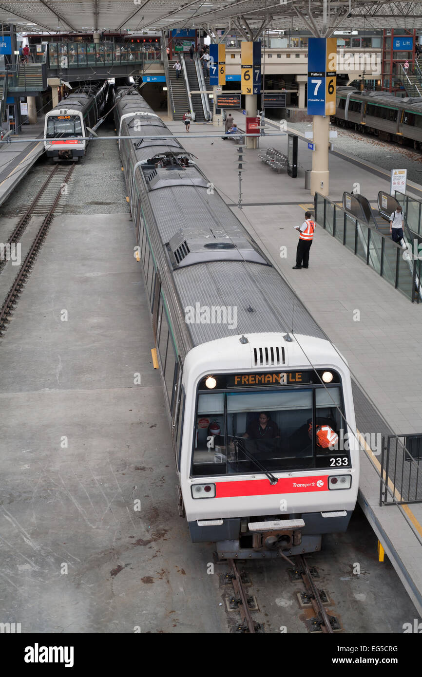 An electric train prepares to leave the Perth central railway station ...