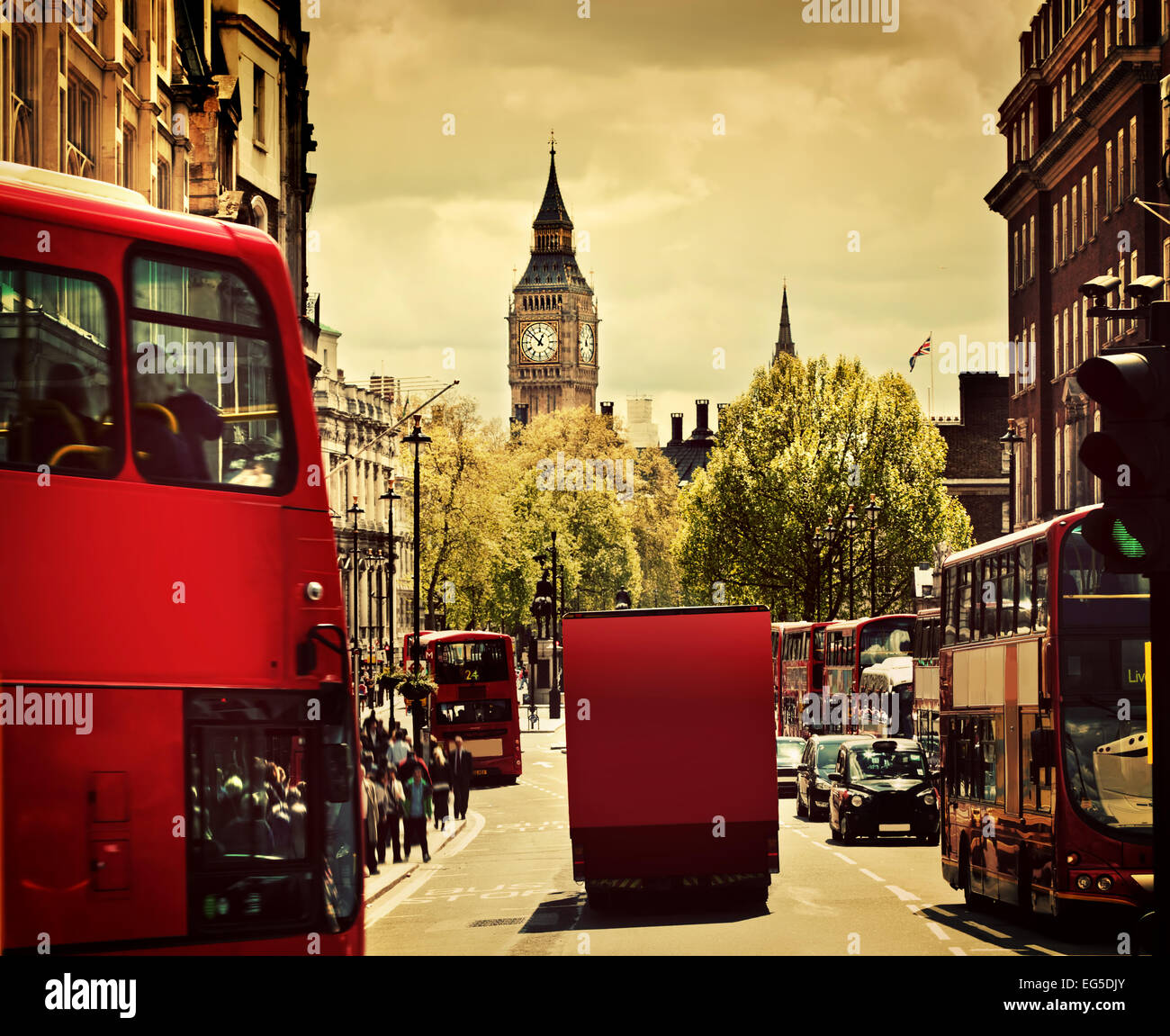 Busy street of London, England, the UK. Red buses, Big Ben in the ...